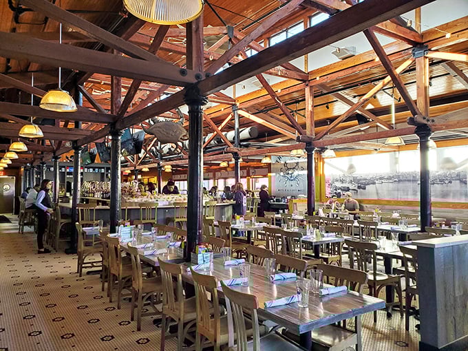 Wooden beams, natural light, and tables set for seafood feasts—the dining room feels like the world's most inviting ship's cabin.