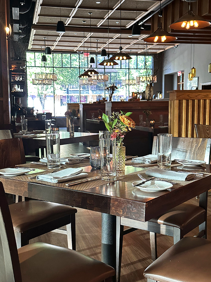 Tables set with anticipation—each place setting awaits its starring role in someone's perfect evening out.