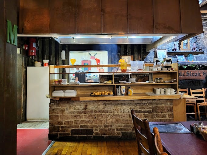 Brick, wood, and the promise of homemade desserts—this self-service area is where patience becomes the hardest virtue to maintain.