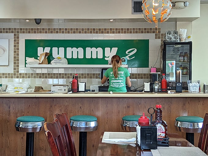 Where breakfast dreams come true. The counter's mint-green backdrop frames the kitchen ballet that produces morning magic plate after plate.