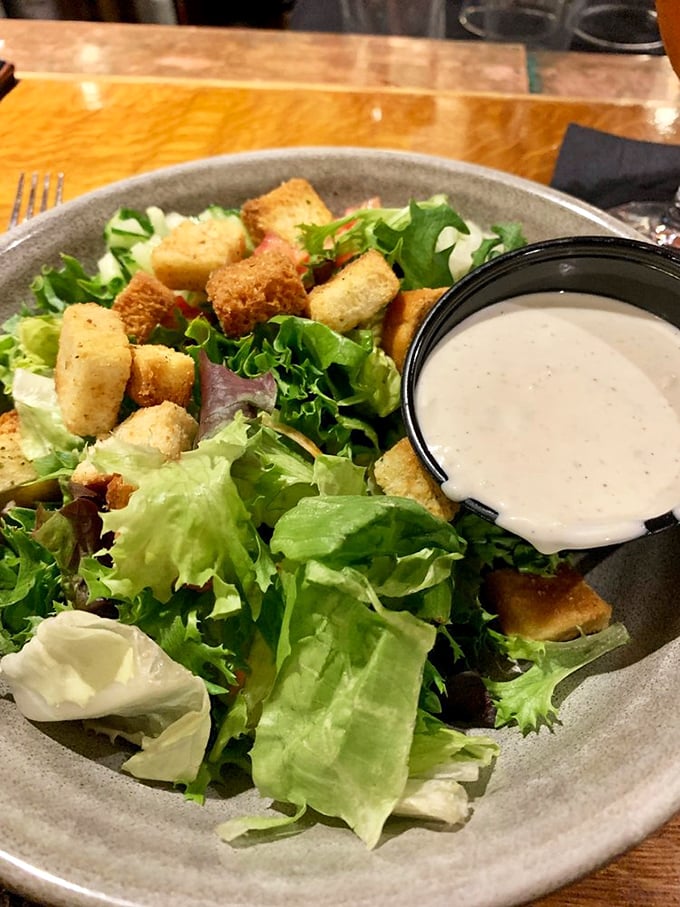 Even the side salad gets the star treatment here. Those perfectly golden croutons aren't phoning it in—they're auditioning for the lead role.