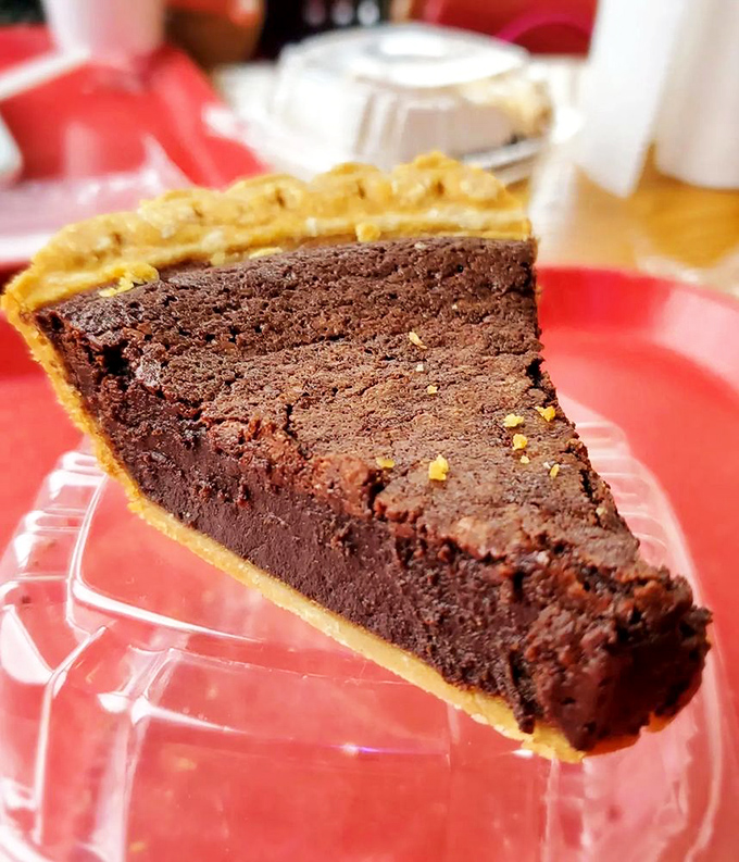 A slice of chocolate pie so dense and rich it should come with its own warning label and inheritance plan.