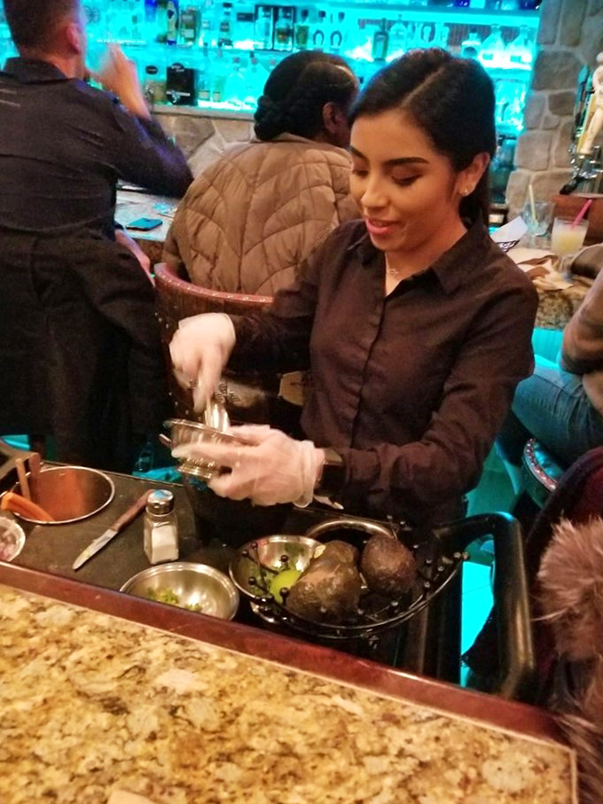 Tableside guacamole preparation isn't just service—it's dinner theater. Fresh ingredients becoming something greater than the sum of their parts before your eyes.