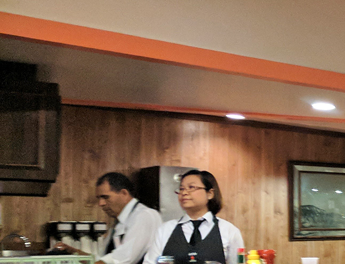 The hardworking staff orchestrates the diner symphony with precision and a smile.