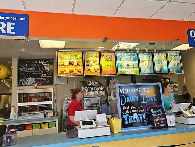 Behind the counter, where island magic happens—soft serve machines whirring and order screens glowing with promised delights.
