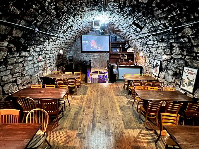 The cave's upper level feels like discovering a secret room in Hogwarts – stone walls, wooden tables, and an atmosphere thick with history.