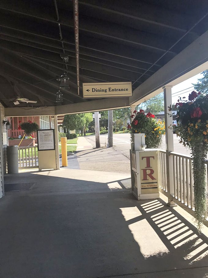 The entrance beckons with the promise of comfort food nirvana. Those hanging flower baskets aren't decoration—they're a colorful runway guiding you to deliciousness.