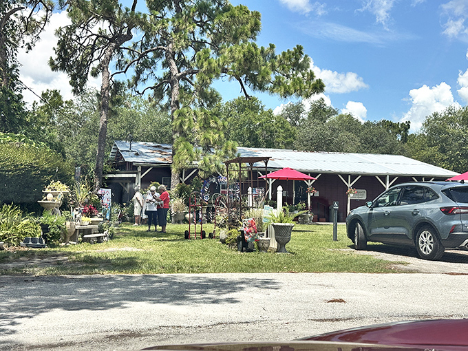 The approach to culinary paradise is appropriately humble—just a simple path leading to a red building where food memories are waiting to be made.