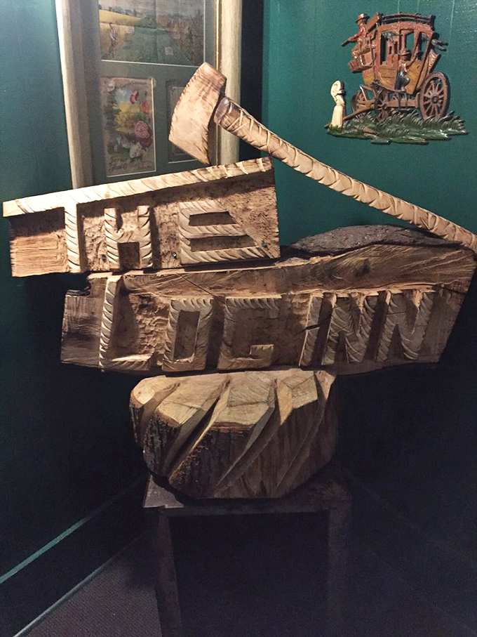 A wooden carving proudly announcing "THE LOG INN" – because sometimes the most meaningful art isn't in museums, it's in restaurants.