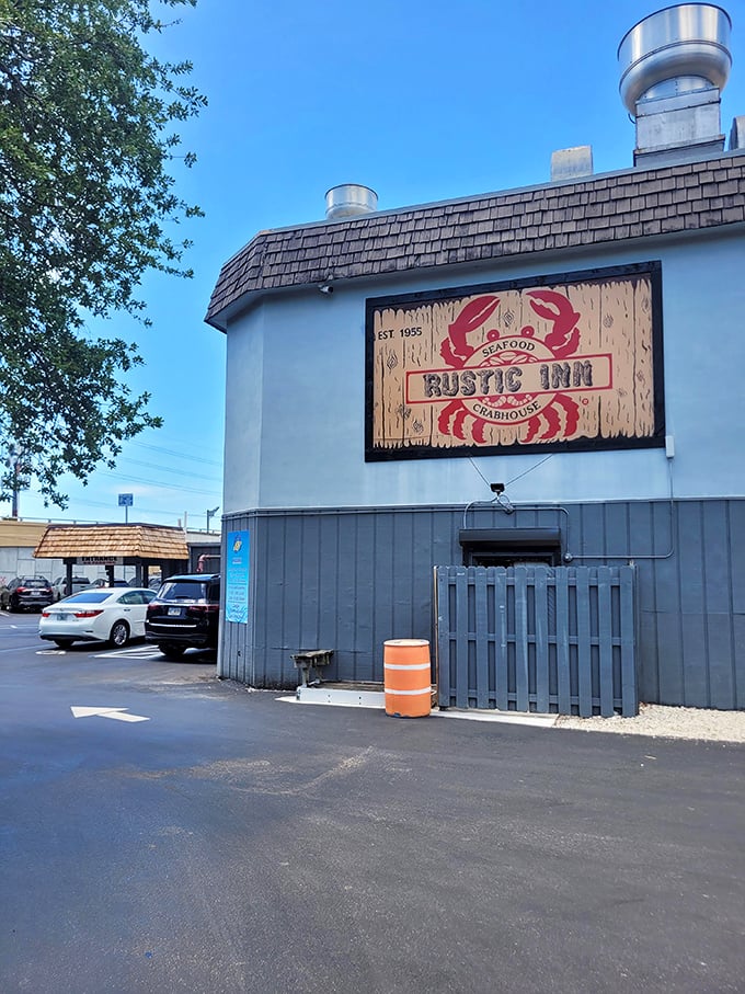 Behind that wooden sign lies a fortress dedicated to the noble art of getting deliciously messy with garlic crabs.