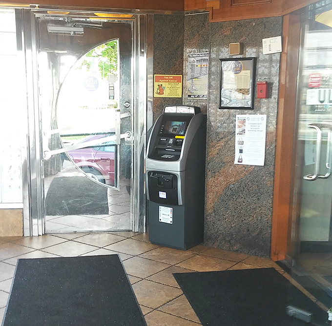 Even the ATM looks like it belongs here – patiently waiting to facilitate that second slice of pie you're definitely going to order.