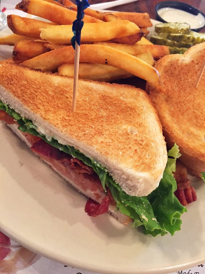 This BLT isn't messing around – perfectly toasted bread, generous bacon, and fresh lettuce create the sandwich equivalent of a greatest hits album. The fries are just showing off.