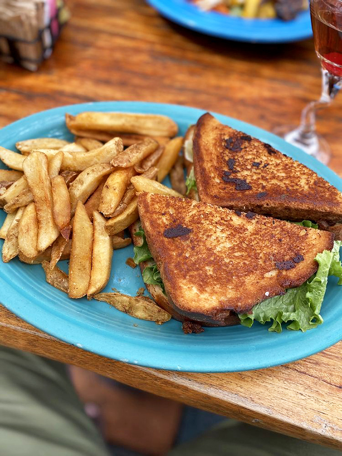 The sandwich that launched a thousand lunch breaks. Golden-toasted bread hugging its fillings like it's afraid they'll escape – and with good reason.