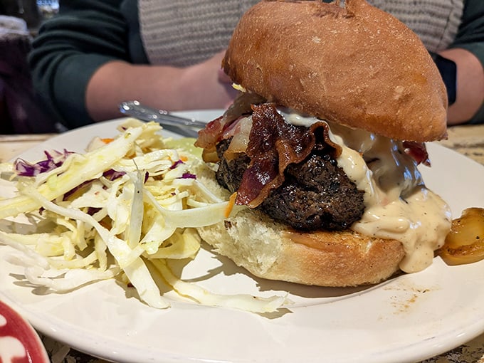A burger that requires both hands and a strategy. That beer cheese sauce cascading down the sides isn't just delicious—it's a delightful engineering challenge.
