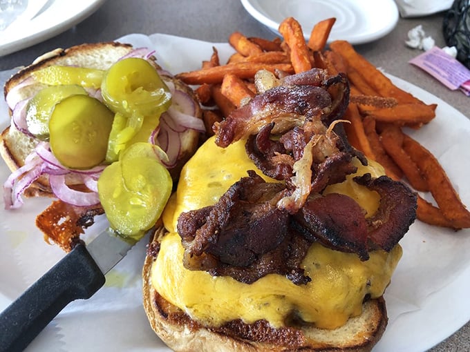 A burger that doesn't need a fancy name, just your full attention. Those sweet potato fries aren't a side dish—they're co-stars in this lunch production.