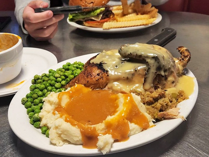 Not all heroes wear capes—some wear gravy. This roasted chicken dinner with mashed potatoes delivers comfort food credentials that would make your grandmother proud.