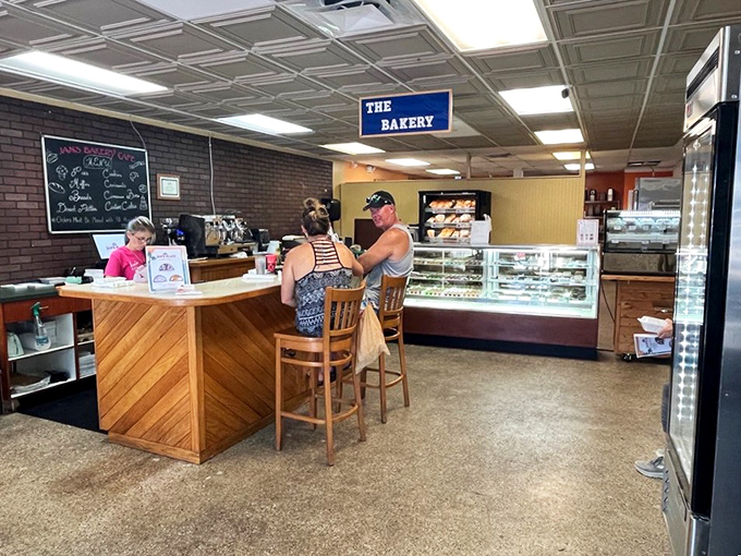 The bakery counter—where willpower goes to die a happy, flaky, butter-scented death. Diet starts tomorrow, promises made while pointing at pastries.