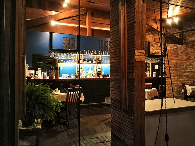 The bar area glows with promise, a beacon of hospitality where spirits meet spirits in the best possible way.