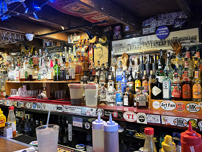 The bar doesn't just serve drinks—it serves history, with every sticker and bottle telling tales of good times past and those yet to come.