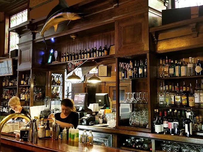 Bottles lined up like soldiers ready for duty. This isn't just a bar – it's a liquid library of possibilities.