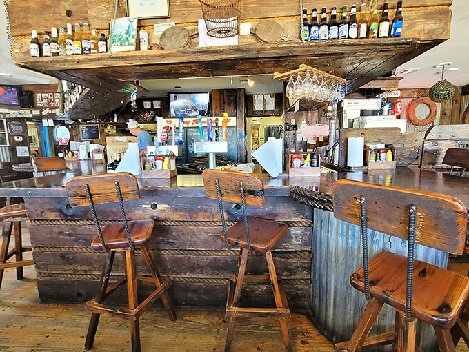 The weathered wood bar looks like it could tell stories of countless fishing tales—some of which might actually be true.