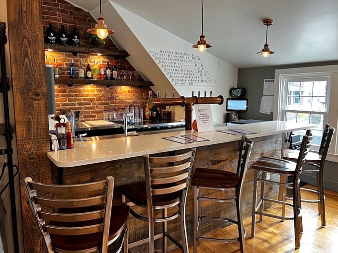 The bar area combines exposed brick, warm wood, and industrial lighting to create a space where lingering over coffee feels like the day's most important appointment.