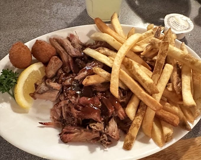 BBQ that doesn't need a fancy introduction—just plenty of napkins and your undivided attention. The fries are just there for moral support.