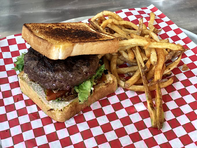 This burger on toast instead of a bun is the culinary equivalent of wearing sneakers with a suit—unexpectedly perfect and ready for business.