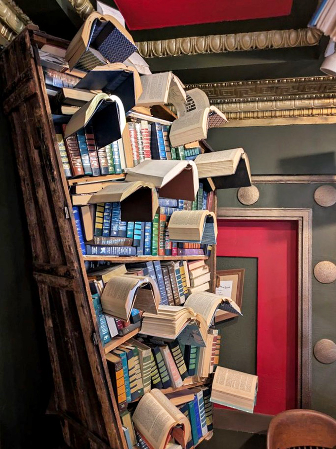 Books take flight in this gravity-defying installation that makes bibliophiles wonder if their home libraries could use similar decorating.