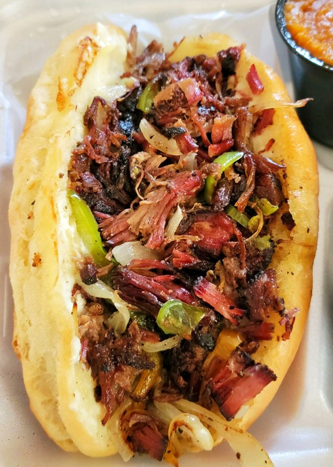 When barbecue meets Philly, magic happens. This sandwich doesn't just cross state lines—it erases them completely.