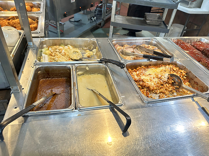 The buffet line – where food dreams come true. Those serving spoons have witnessed countless "just a little more" moments.