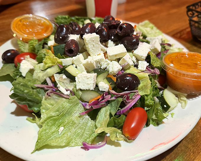 A Greek salad that doesn't skimp on the good stuff. Those olives and feta aren't just toppings—they're the main characters in a Mediterranean love story.