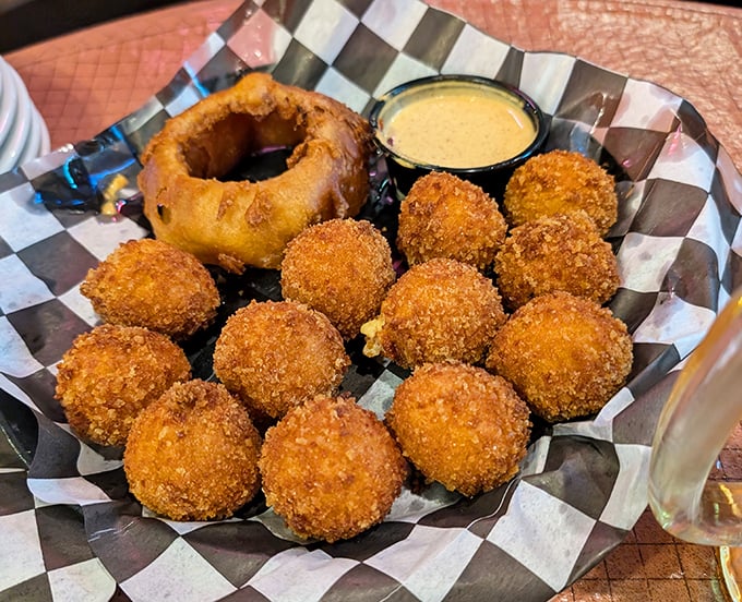 These golden-fried cheese bites with that onion ring centerpiece aren't just appetizers—they're a warm Midwestern hug on a plate.