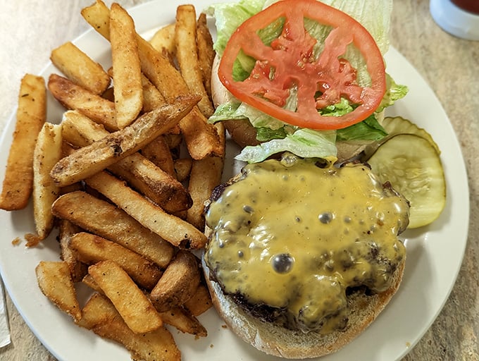 This isn't just a burger—it's edible evidence that someone in the kitchen actually cares about your happiness. Those fries aren't an afterthought either.
