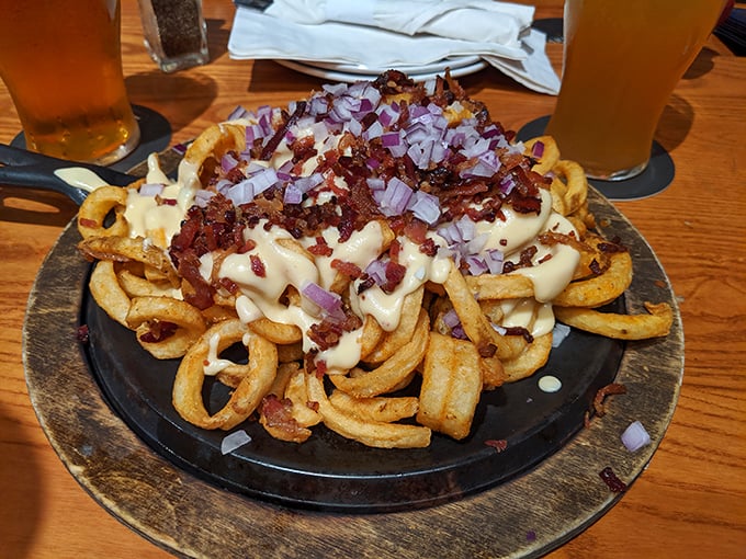 Cheesy bacon fries that could make a cardiologist reconsider their entire professional philosophy completely.