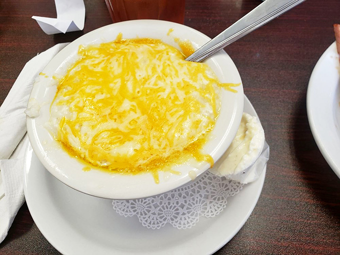 These aren't just grits – they're a golden-topped Southern hug in a bowl, transformed by cheese into something worth crossing state lines for.