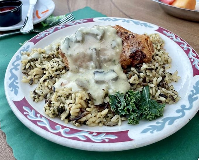 Chicken smothered in mushroom sauce atop wild rice – proof that "smothered" is a culinary term of endearment in Wisconsin supper clubs.