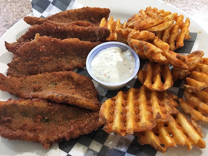 Chicken tenders with the golden ratio of crunch-to-tenderness. Those waffle fries aren't just sides—they're wingmen of the highest caliber.
