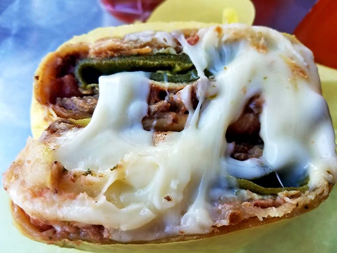 The chile relleno burrito in all its cross-sectional glory—like a geological core sample of deliciousness.