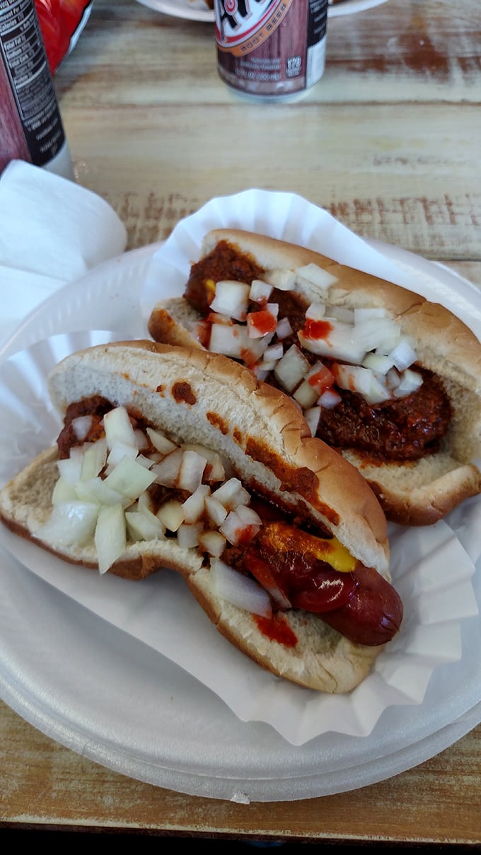 Hot dogs dressed to impress with chili and diced onions—proof that sometimes the most satisfying foods are the ones that require extra napkins.