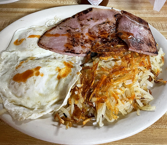Ham steak, eggs, and hash browns – the holy trinity of breakfast that's been starting days right since before Instagram food photos existed.