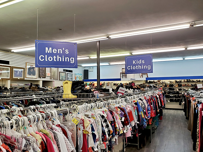 The clothing department: where color-coded organization meets the thrill of the hunt. Blue signs, rainbow inventory, endless possibilities.