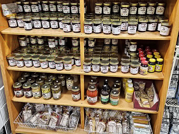 Jams and jellies lined up like soldiers ready for breakfast duty. These aren't supermarket spreads—they're bottled memories of summer's bounty.