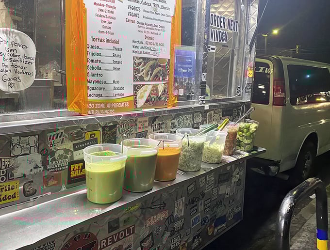 Salsas in technicolor glory—from verde to roja to creamy avocado—waiting to transform your taco from delicious to life-altering with one squeeze.