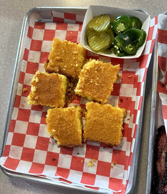 Golden cornbread squares with pickles and jalapeños – the perfect supporting cast for any barbecue main event.