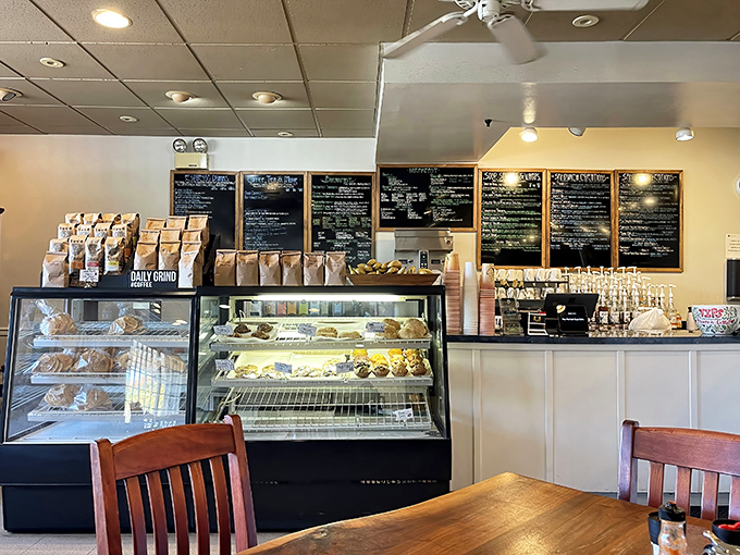 The display case—where breakfast dreams and pastry fantasies collide in a glass-enclosed paradise of possibilities.