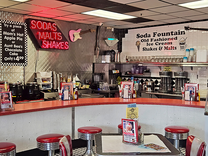Red vinyl stools aren't just seating—they're front-row tickets to the soda fountain show where milkshake magic happens daily.