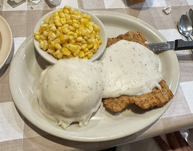 Country fried steak swimming in pepper-flecked gravy with a side of buttery corn—cardiac concern has never tasted so heavenly.