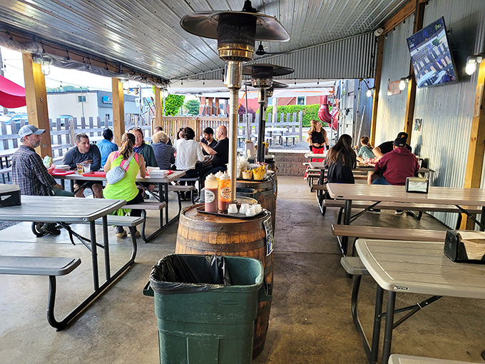 Covered patios and barrel tables create that sweet spot between dining out and feeling like you're at the neighborhood's best cookout.