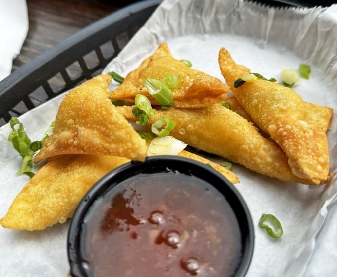 Golden-fried perfection with a side of sweet-spicy sauce. These crunchy parcels deliver that satisfying contrast between crispy exterior and flavorful filling.
